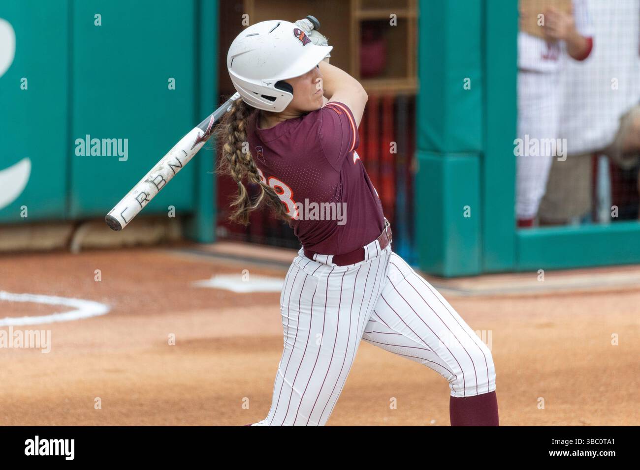 Virginia Tech utility Bre Peck (88) singles in a run against Alabama ...