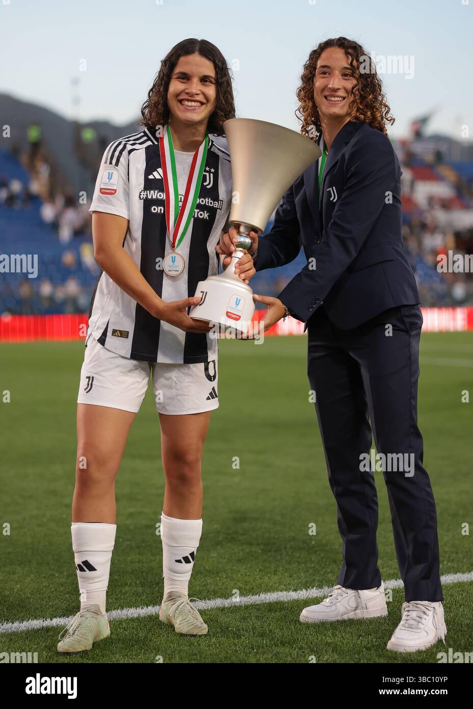 Como, Italy. 17th May, 2025. Eva Schatzer and Azzurra Gallo of Juventus pose with the trophy ...