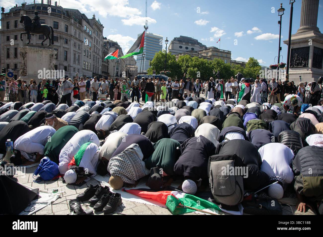 London, England, UK. 17th May 2025. Muslim men pray at Trafalgar Square ...