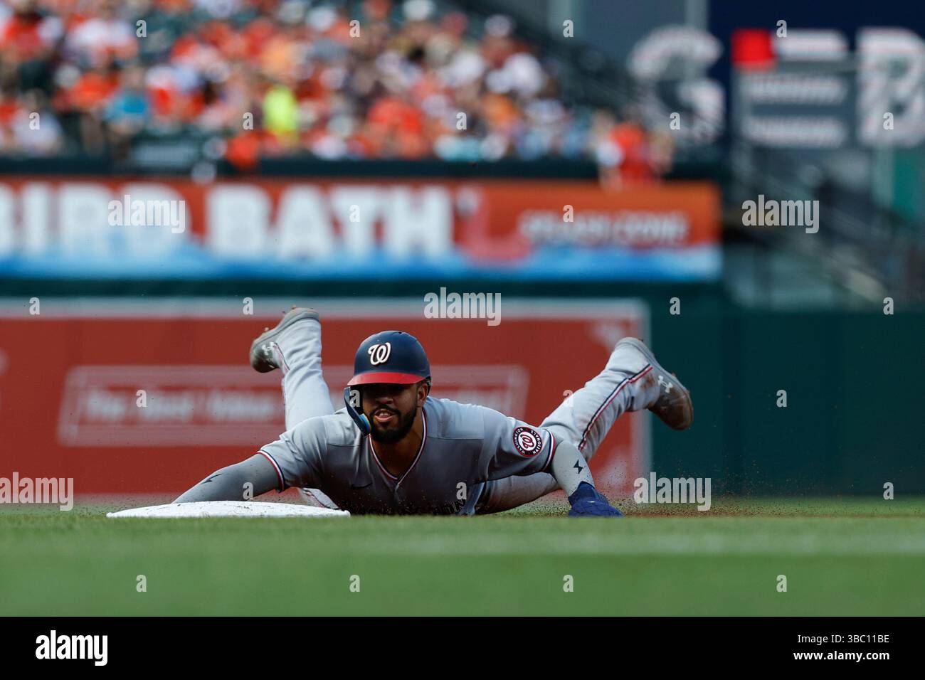 Washington Nationals' Luis García Jr. slides into third base on a ...