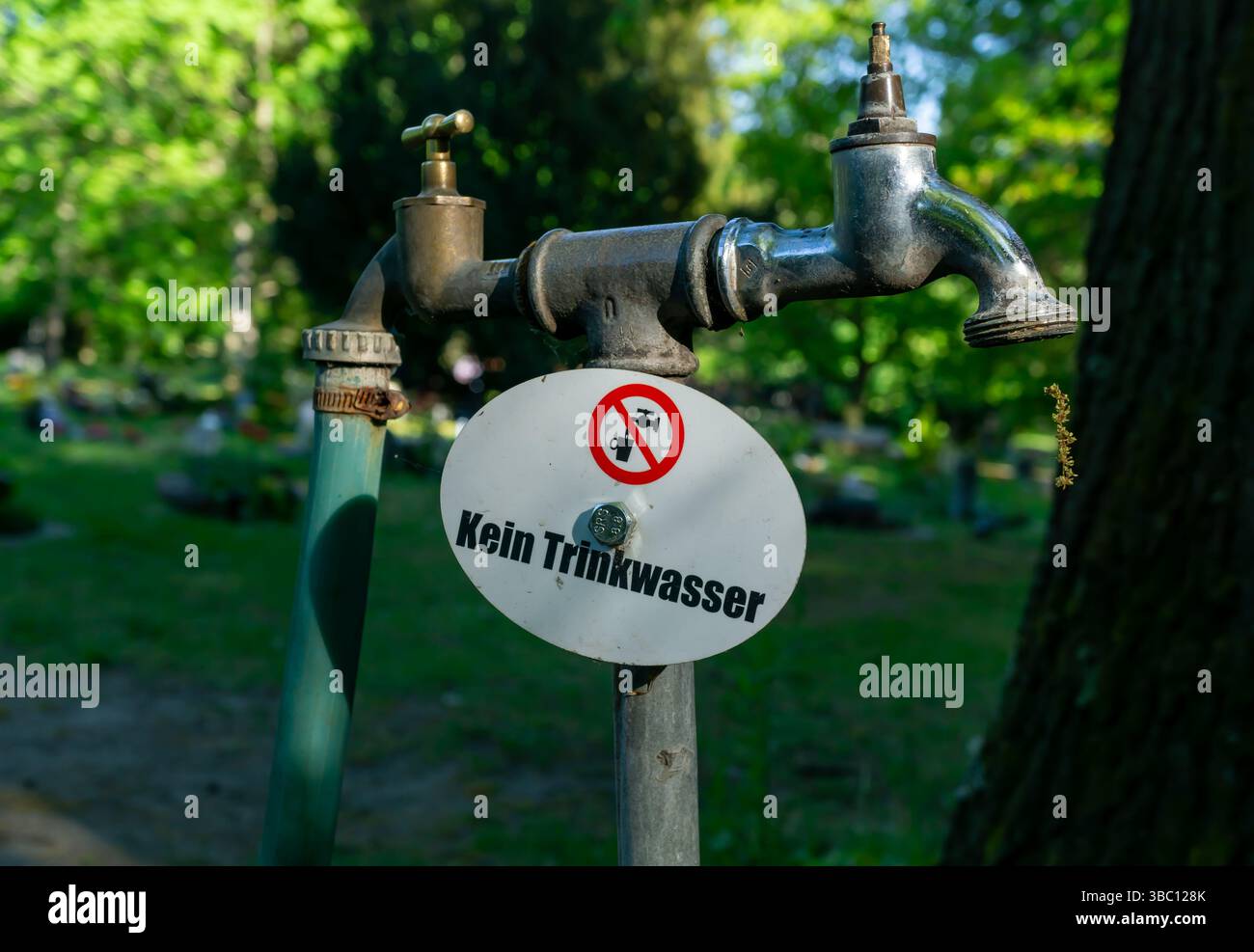 Cemetery water tap with warning sign “Kein Trinkwasser” (No Drinking ...