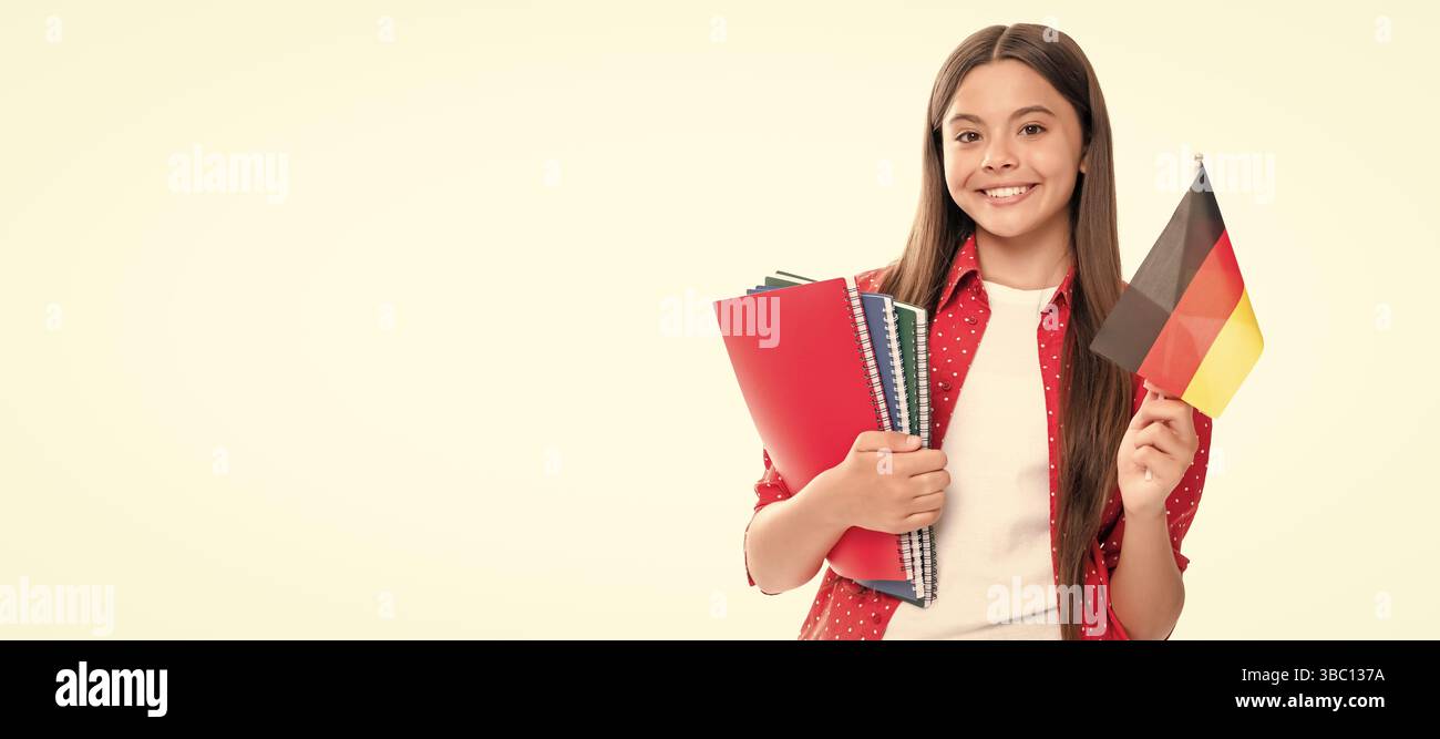 learn foreign language. happy teen girl hold german flag and workbook ...