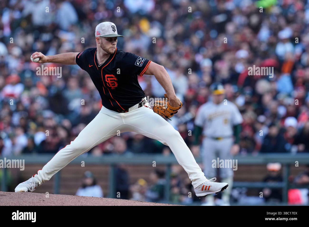 San Francisco Giants pitcher Landen Roupp throws to an Athletics batter ...