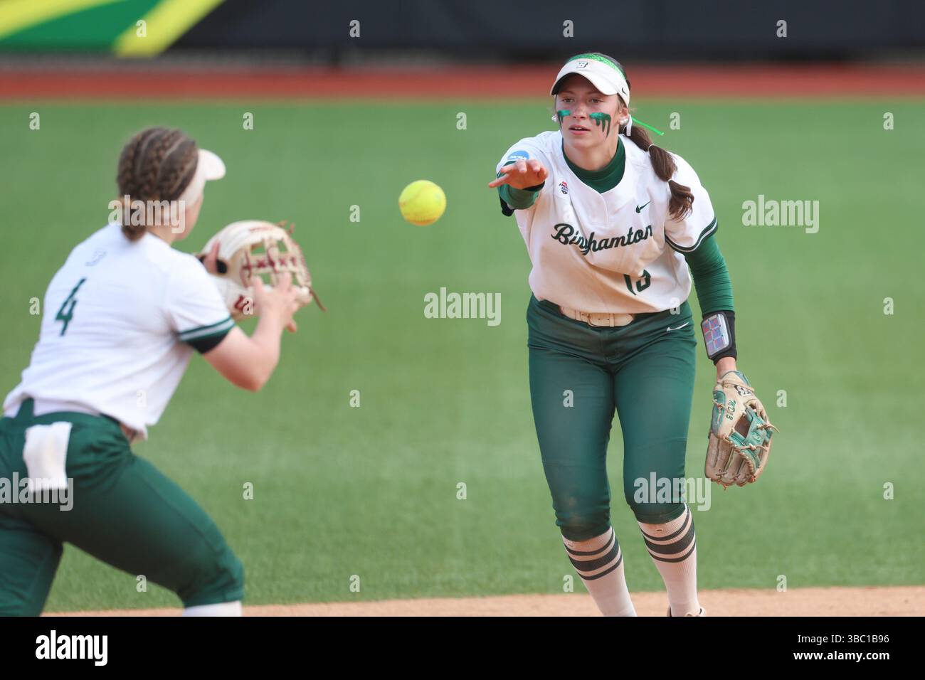 Binghamton utility Maddy Dodig (13) throws to infielder Akira Kopec (4 ...