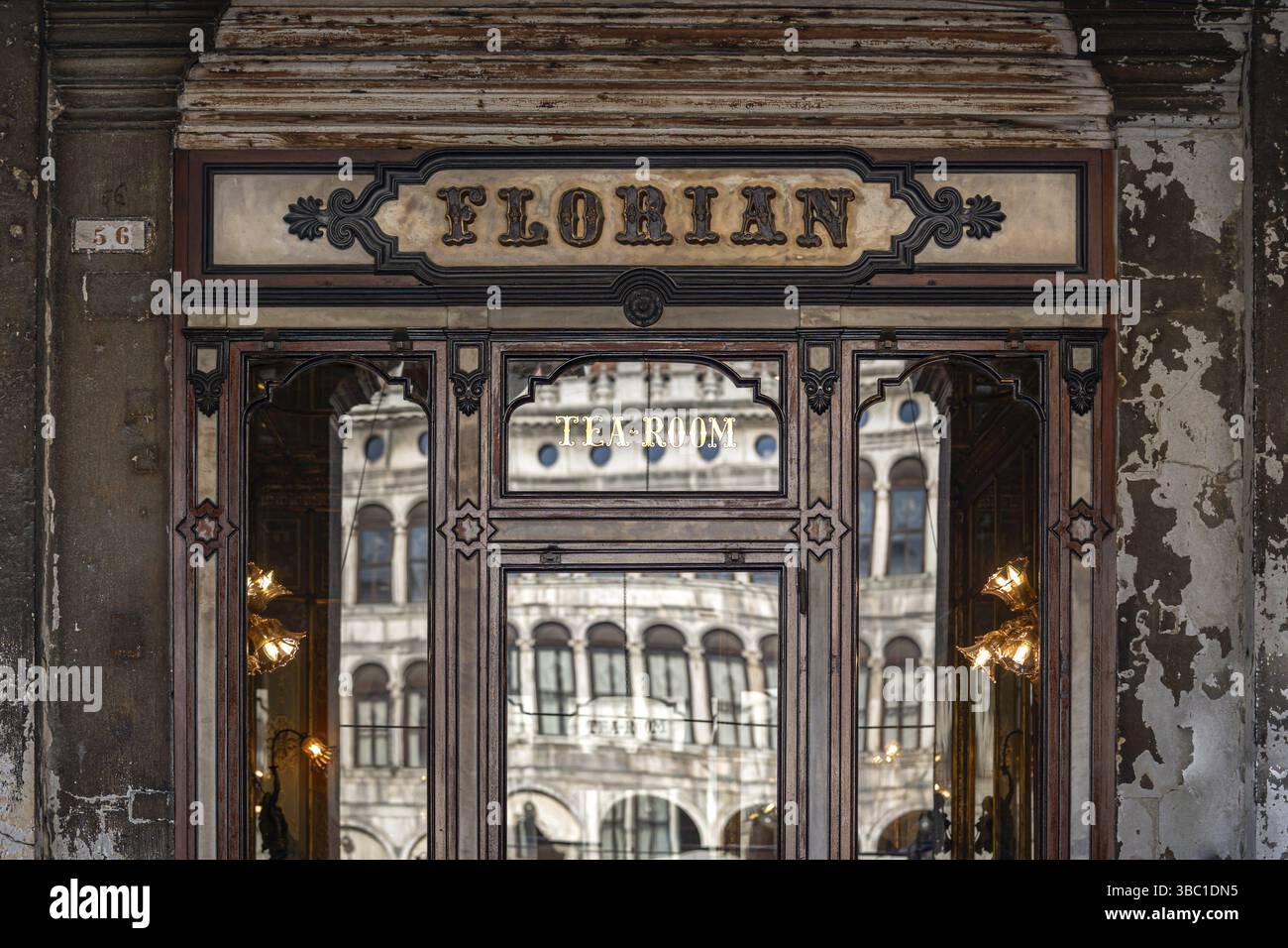 Historic facade of the famous Caffe Florian with reflective windows ...