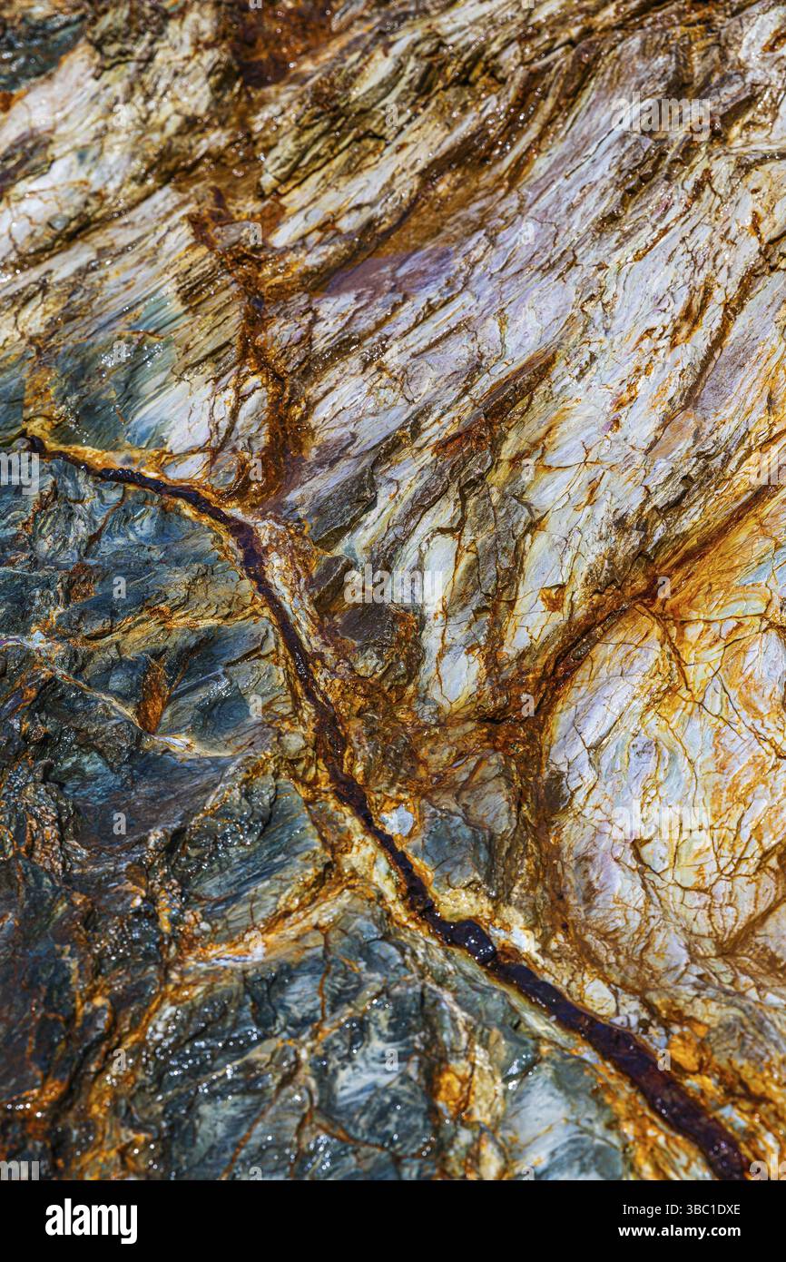 Mineralised rocks on Topinetti beach, near Rio Marina, Elba Island ...