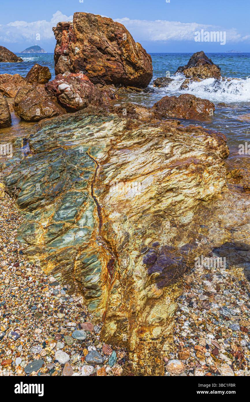 Mineralised rocks on Topinetti beach, near Rio Marina, Elba Island ...