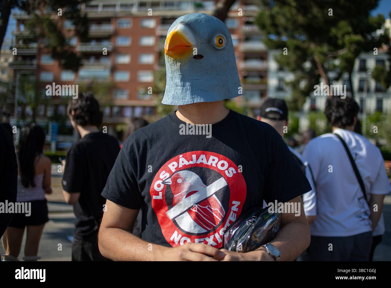 Madrid, Spain. 17th May, 2025. A protester wears a bird mask during the ...