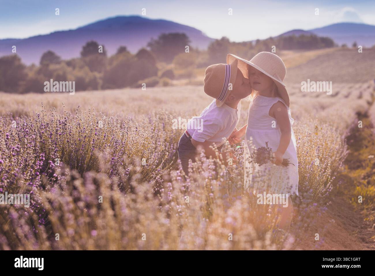 Two adorable kids, boy and girl, standing opposite each other in ...