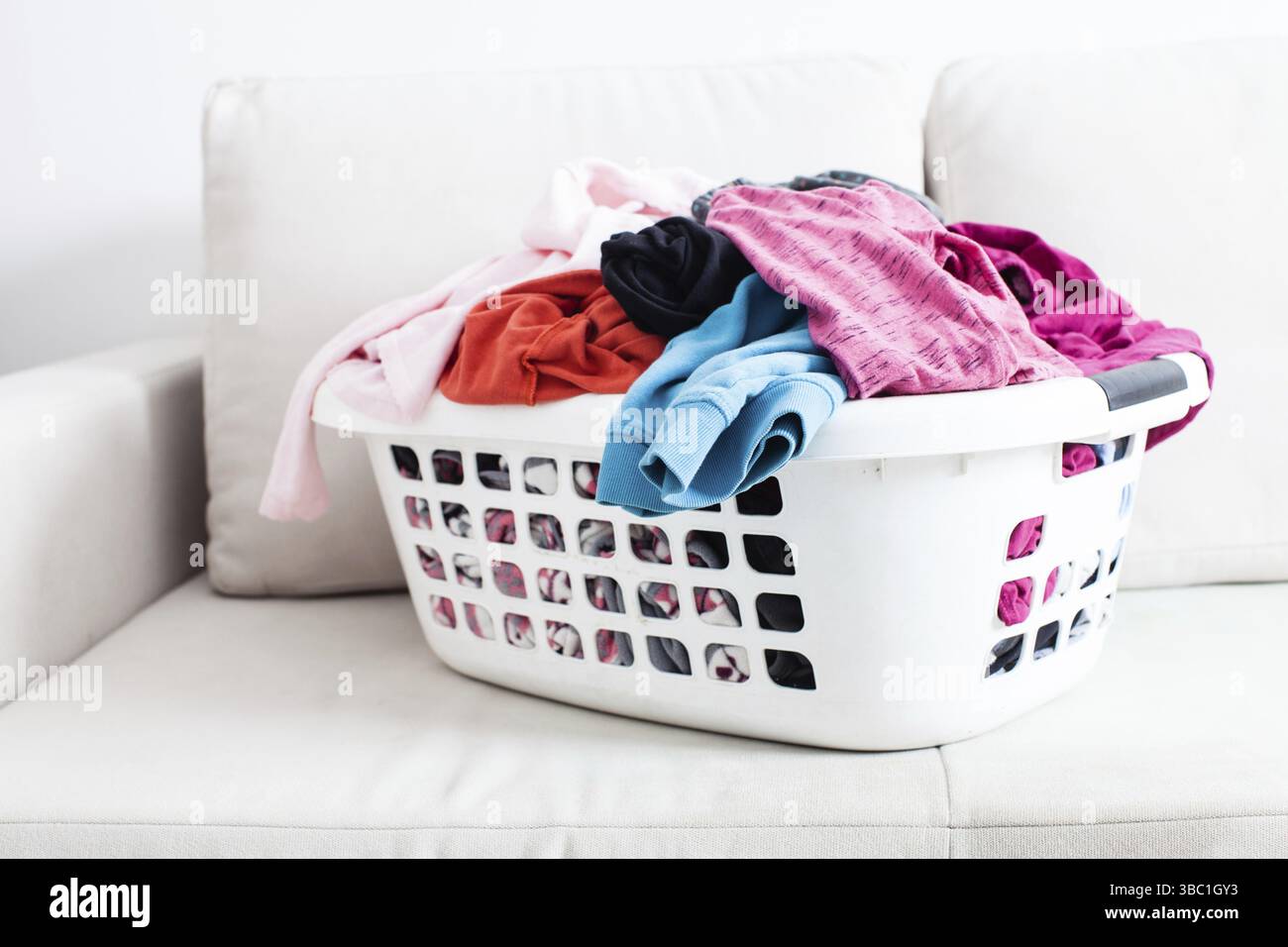 Washed clothes in a basket. Laundry concept Stock Photo - Alamy