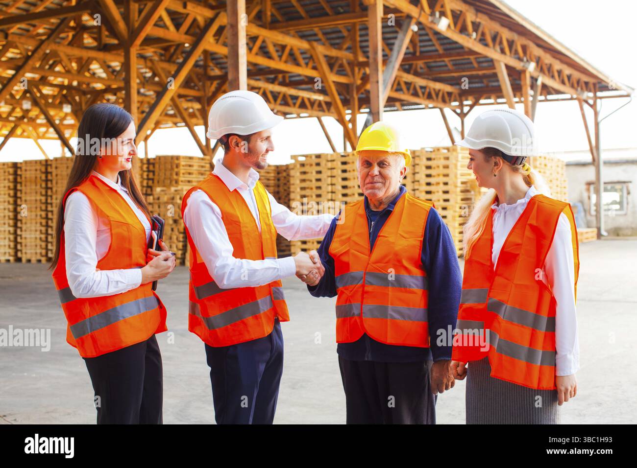 Group builders engineers greeting hi-res stock photography and images ...
