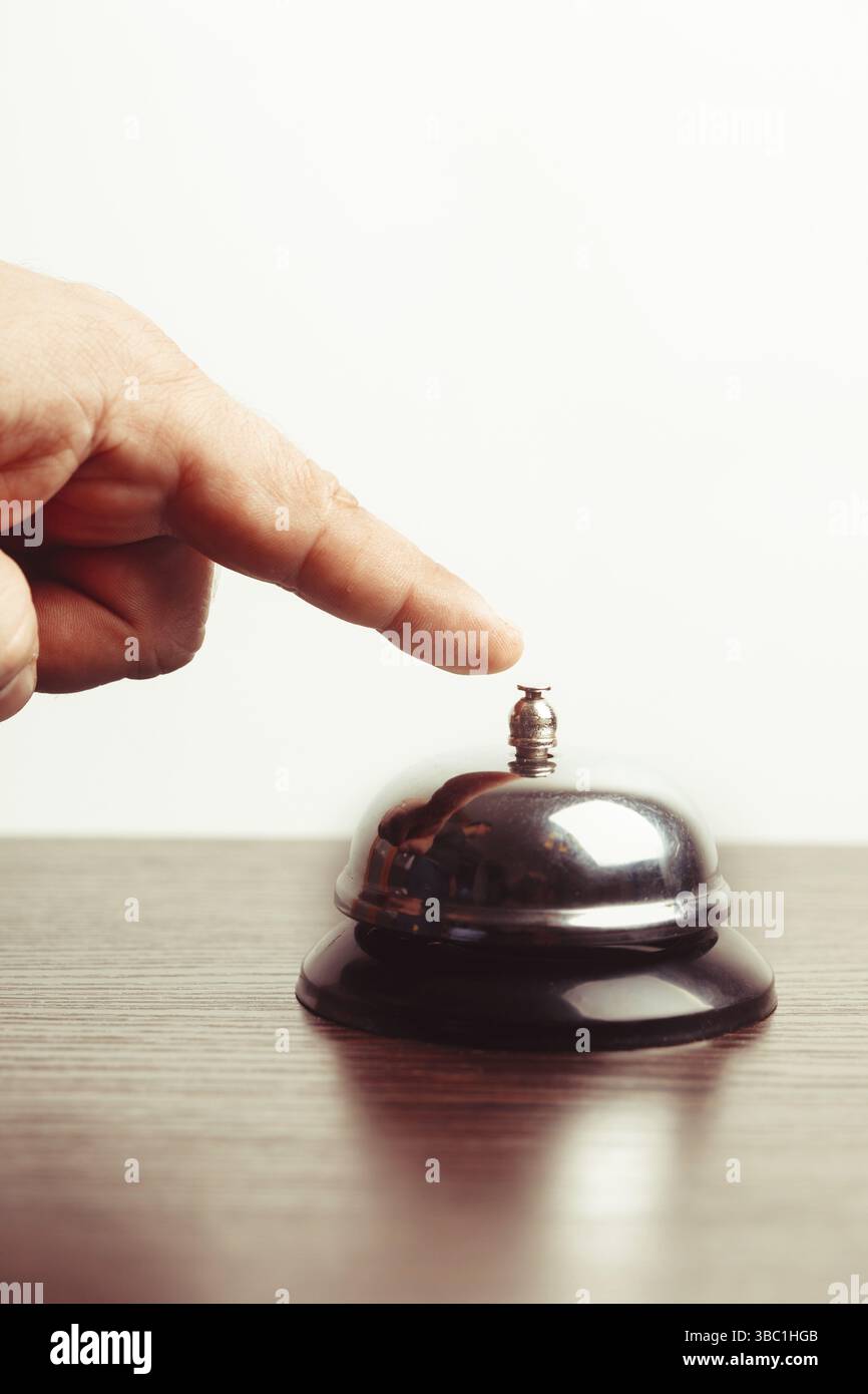 Close-up finger that presses of the service bell ring Stock Photo - Alamy