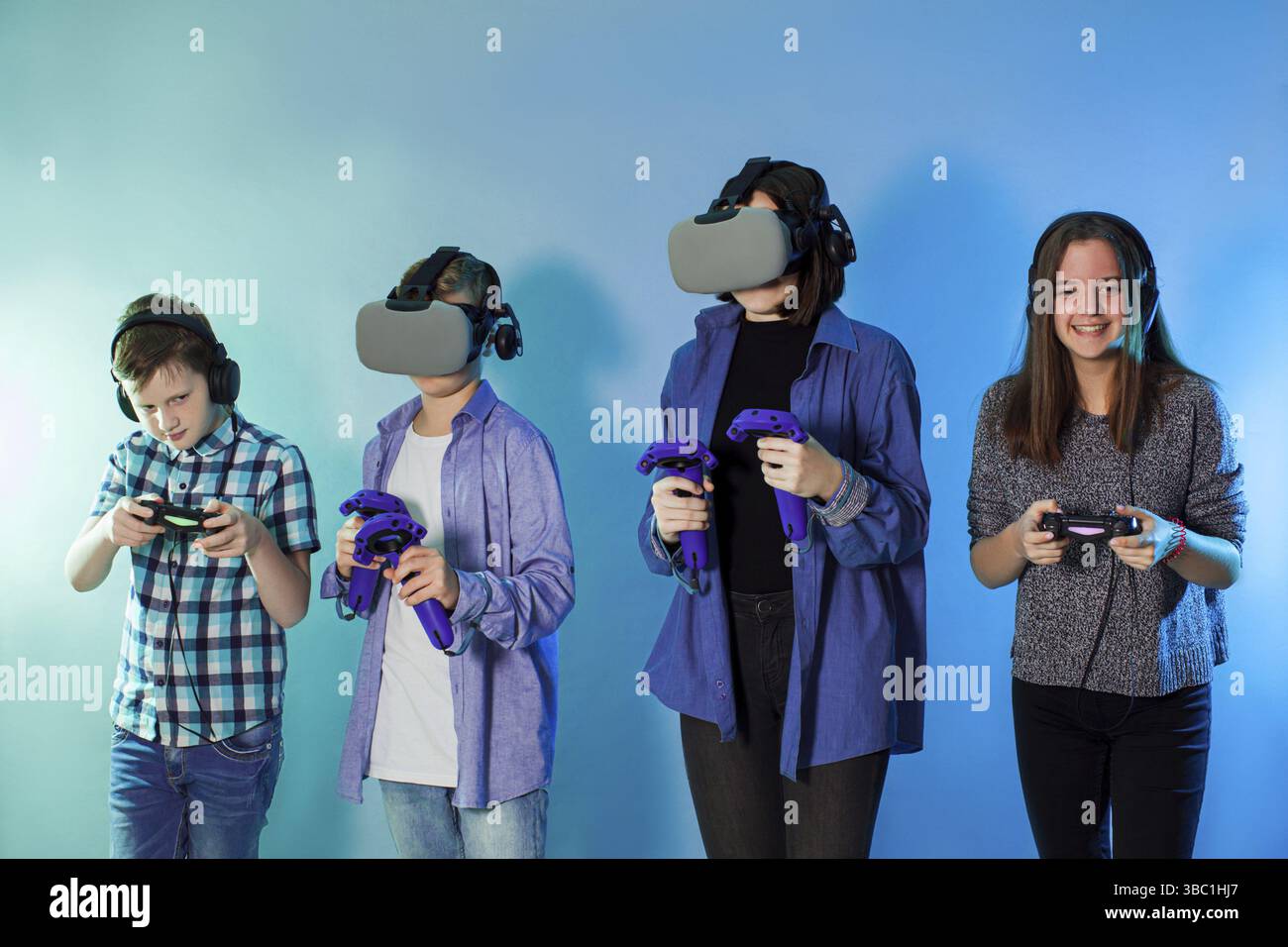 Group of kids using a gaming gadgets for virtual reality. Virtual ...
