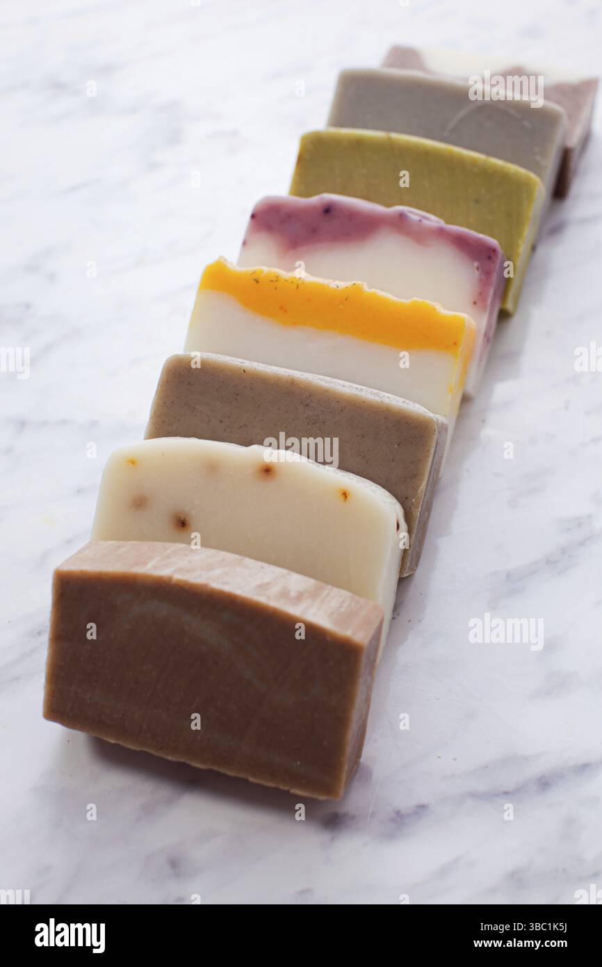 Soap slices close-up. Row of organic soap with various natural flavours ...