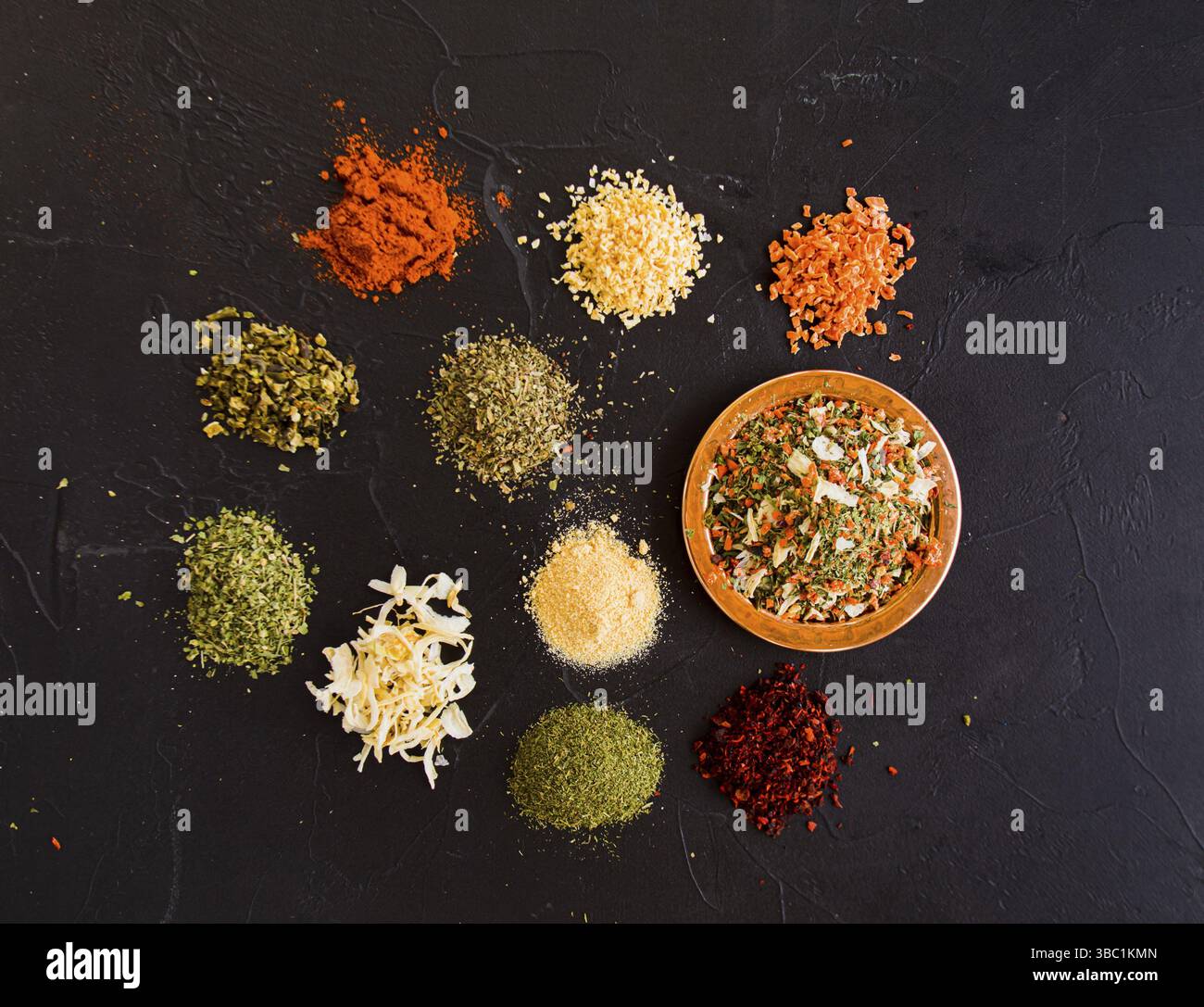 Delicious collection of ten spices for seasoning the food. Piles of ...
