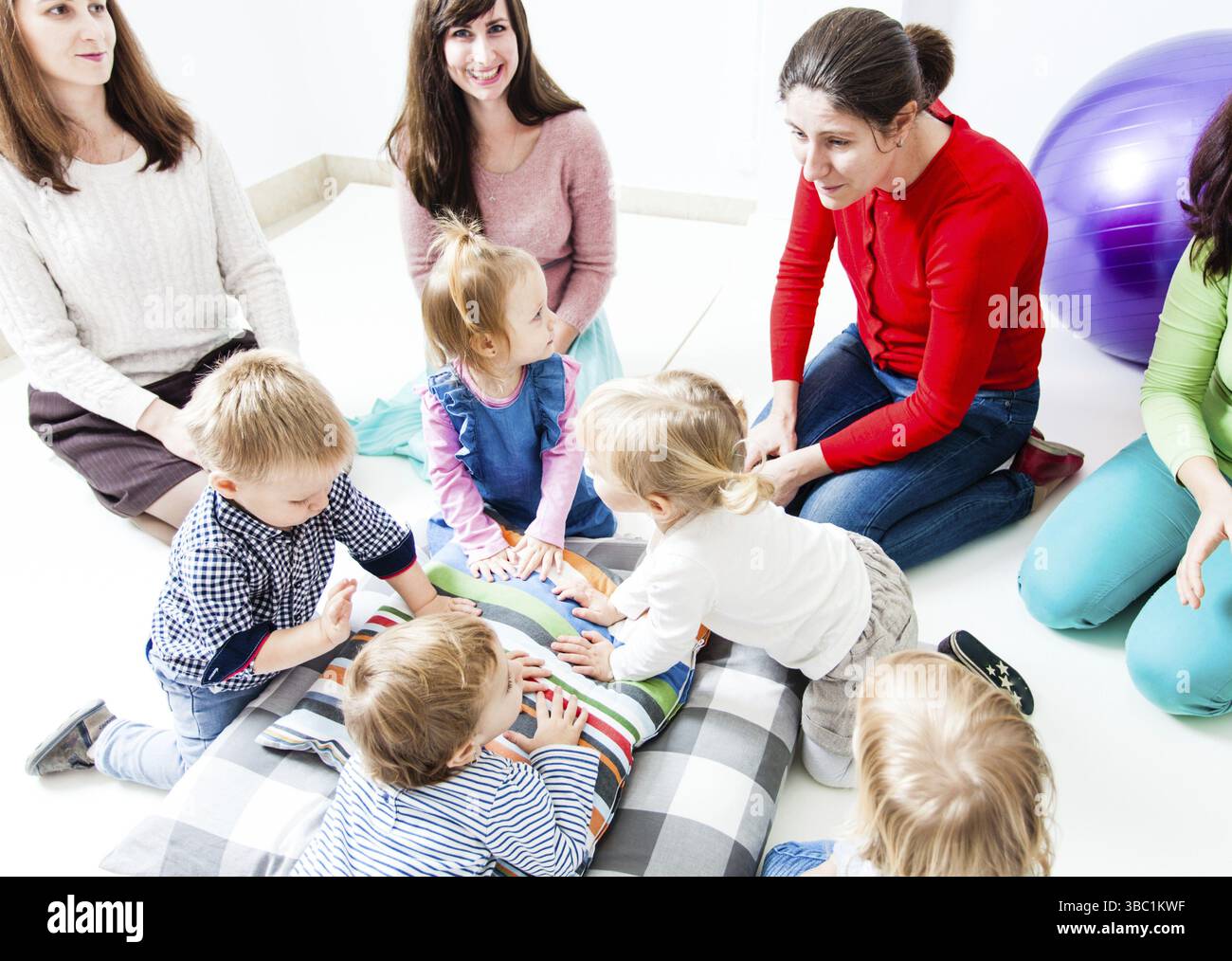 The first acquaintance of children in the kindergarten. Moms acquaint ...