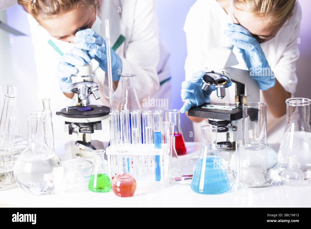 Two scientists in the chemical laboratory are doing experiments Stock ...