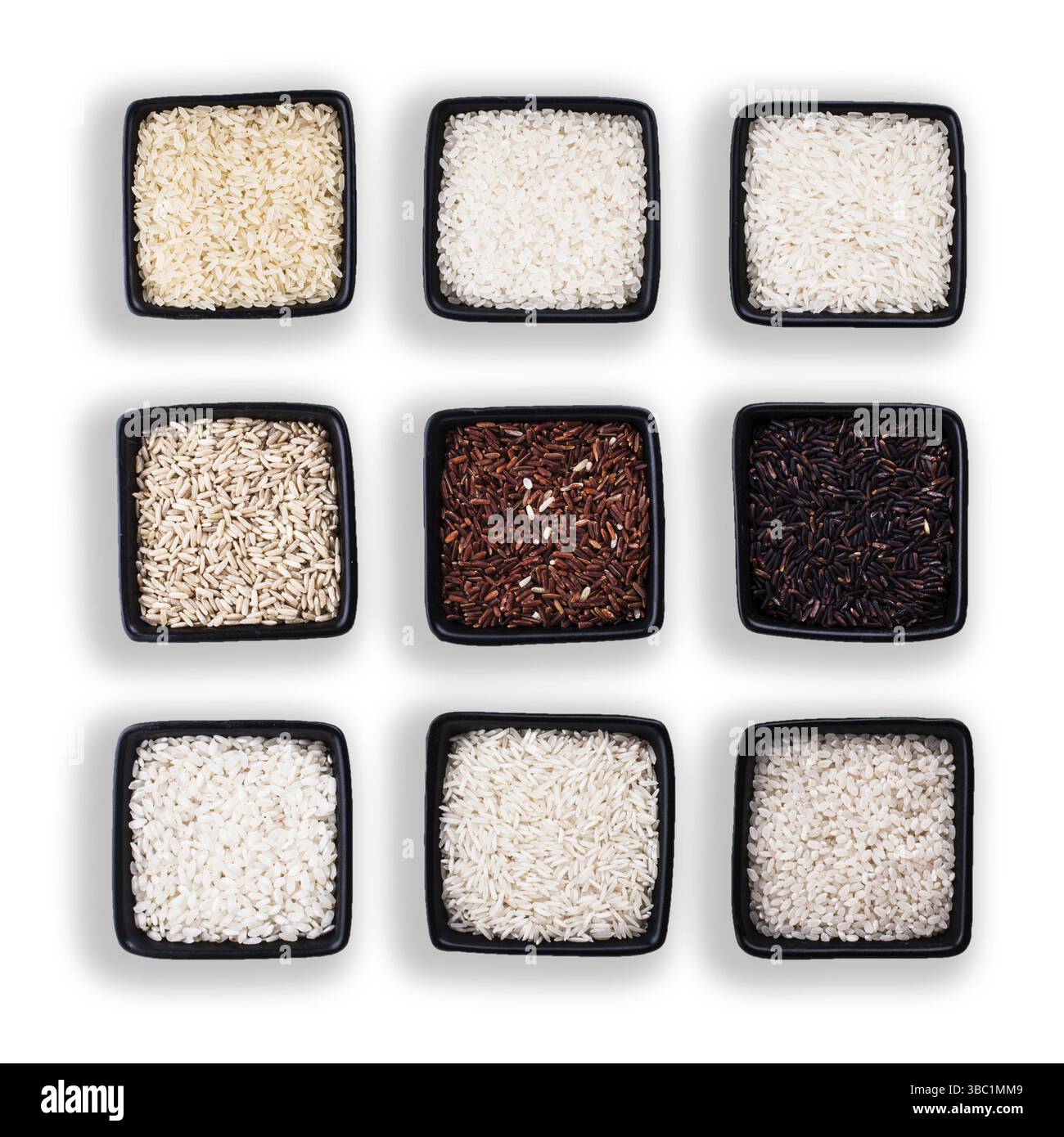 Various types of rice in black bowls isolated on white Stock Photo - Alamy