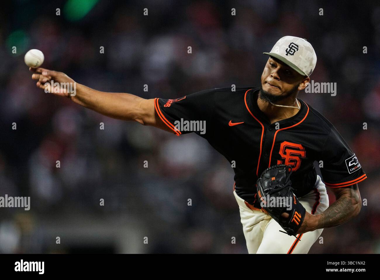 San Francisco Giants pitcher Camilo Doval throws to an Athletics batter during the 10th inning ...