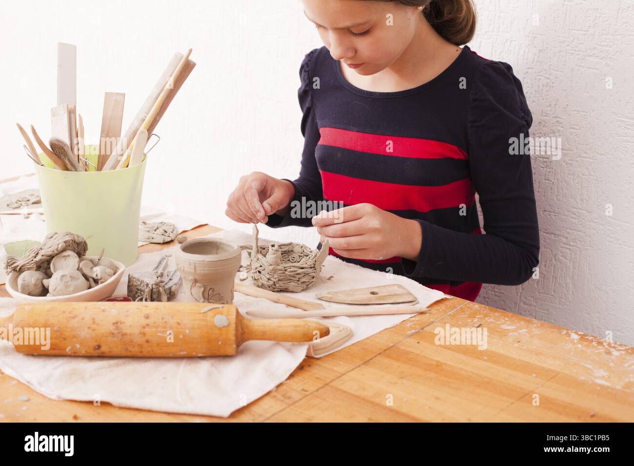 Process modeling figures from the modeling clay Stock Photo - Alamy