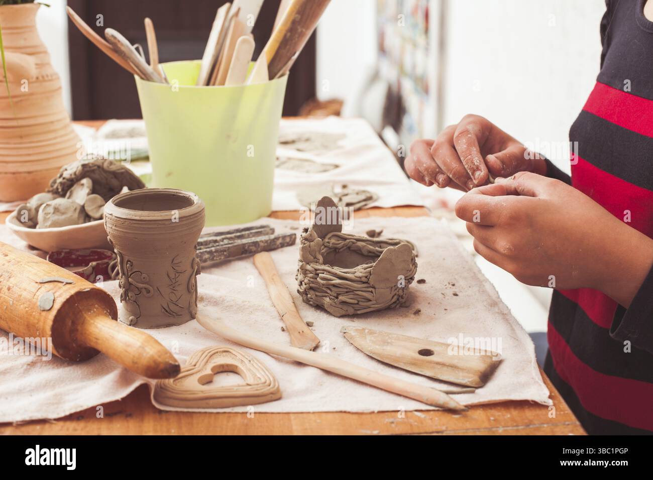 Process modeling figures from the modeling clay Stock Photo - Alamy