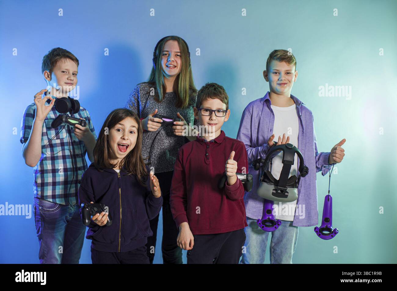 Group of kids using a gaming gadgets for virtual reality. Virtual ...