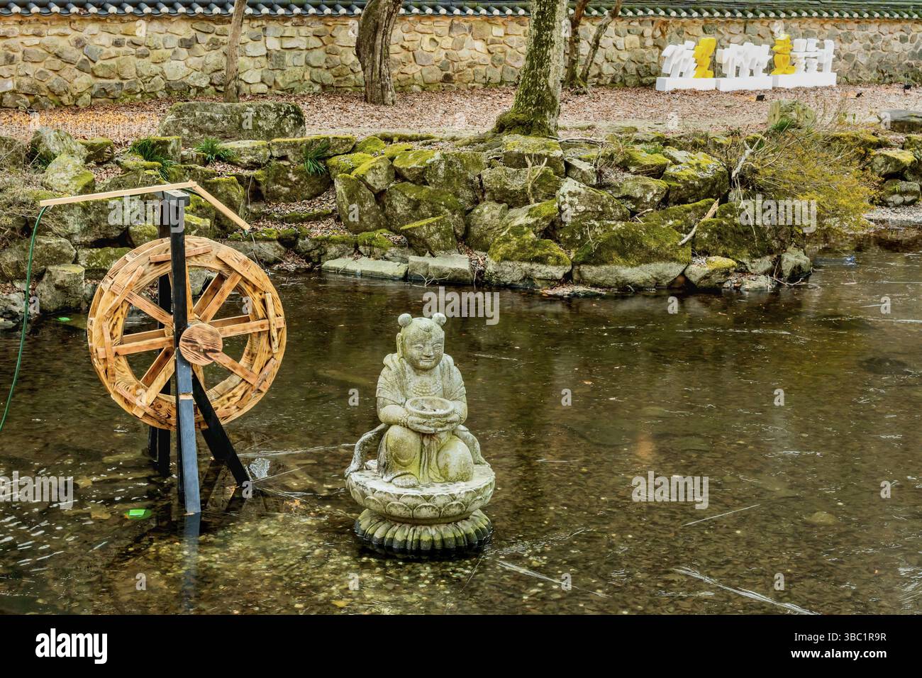 Jeongeup-si, South Korea. December 8, 2020: Statue of monk and wooden ...