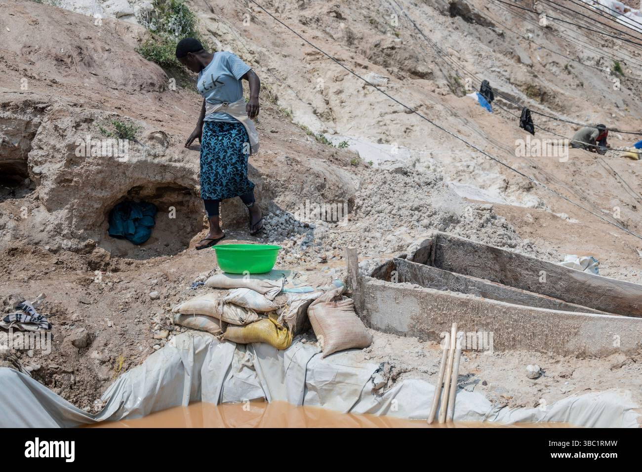 Miners work at the D4 Gakombe coltan mining quarry in Rubaya ...