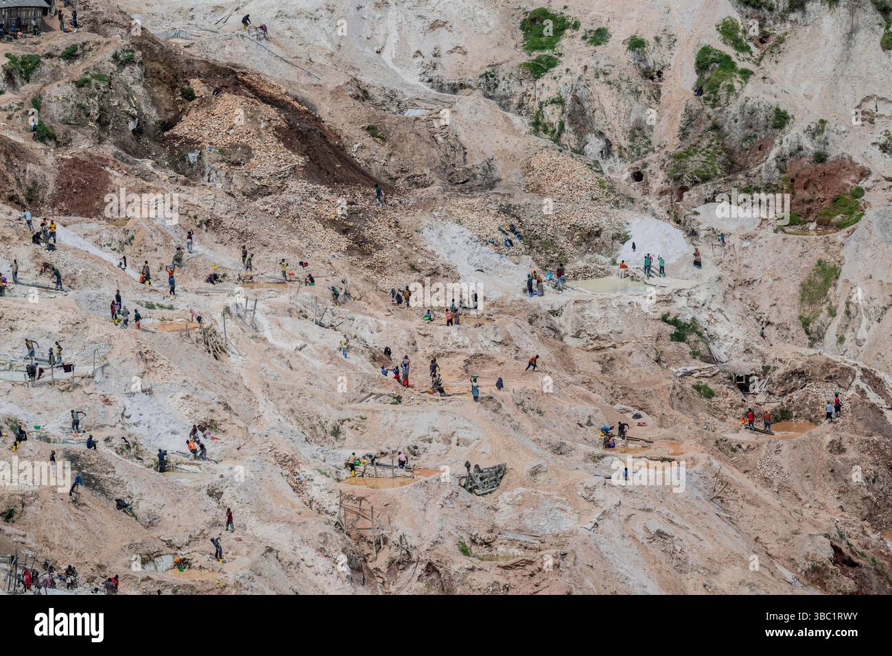 Miners work at the D4 Gakombe coltan mining quarry in Rubaya ...