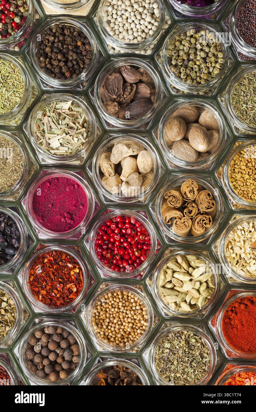 Various spices and herbs in bottles, top view, vivid and bright food ...