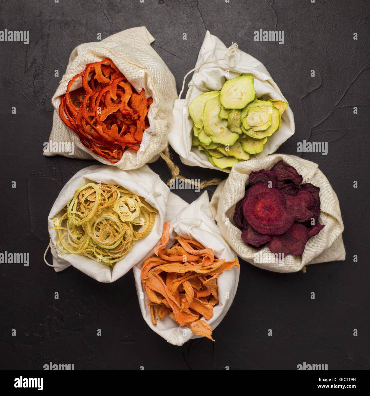 Dehydrated vegetables in textile bags on black background Stock Photo ...