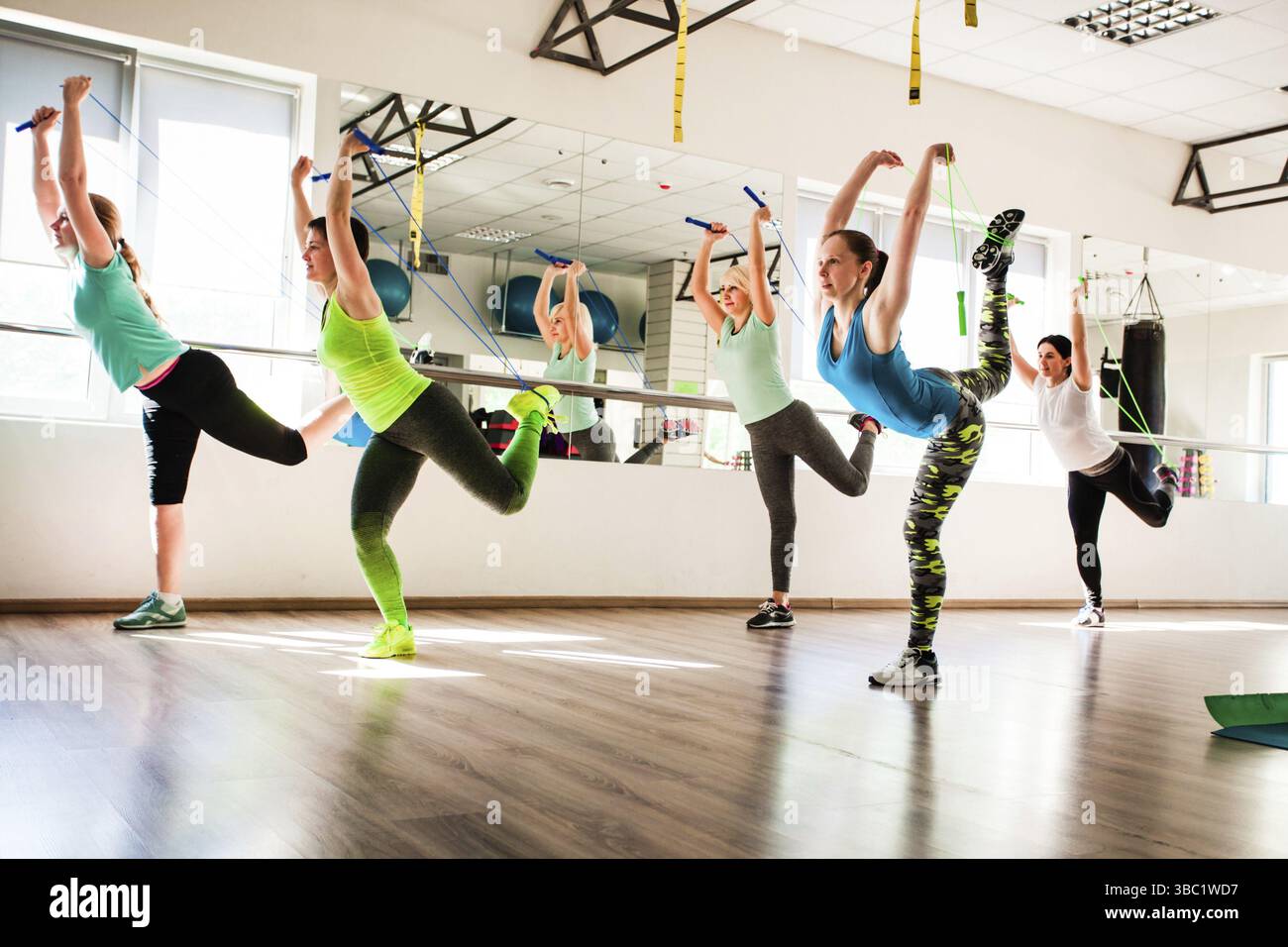 Group of fitness women trains with jump rope at the gym Stock Photo - Alamy