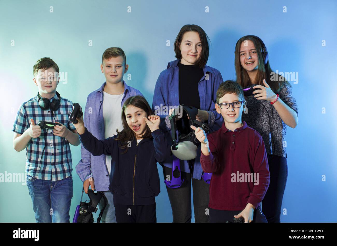 Group of kids using a gaming gadgets for virtual reality. Virtual ...