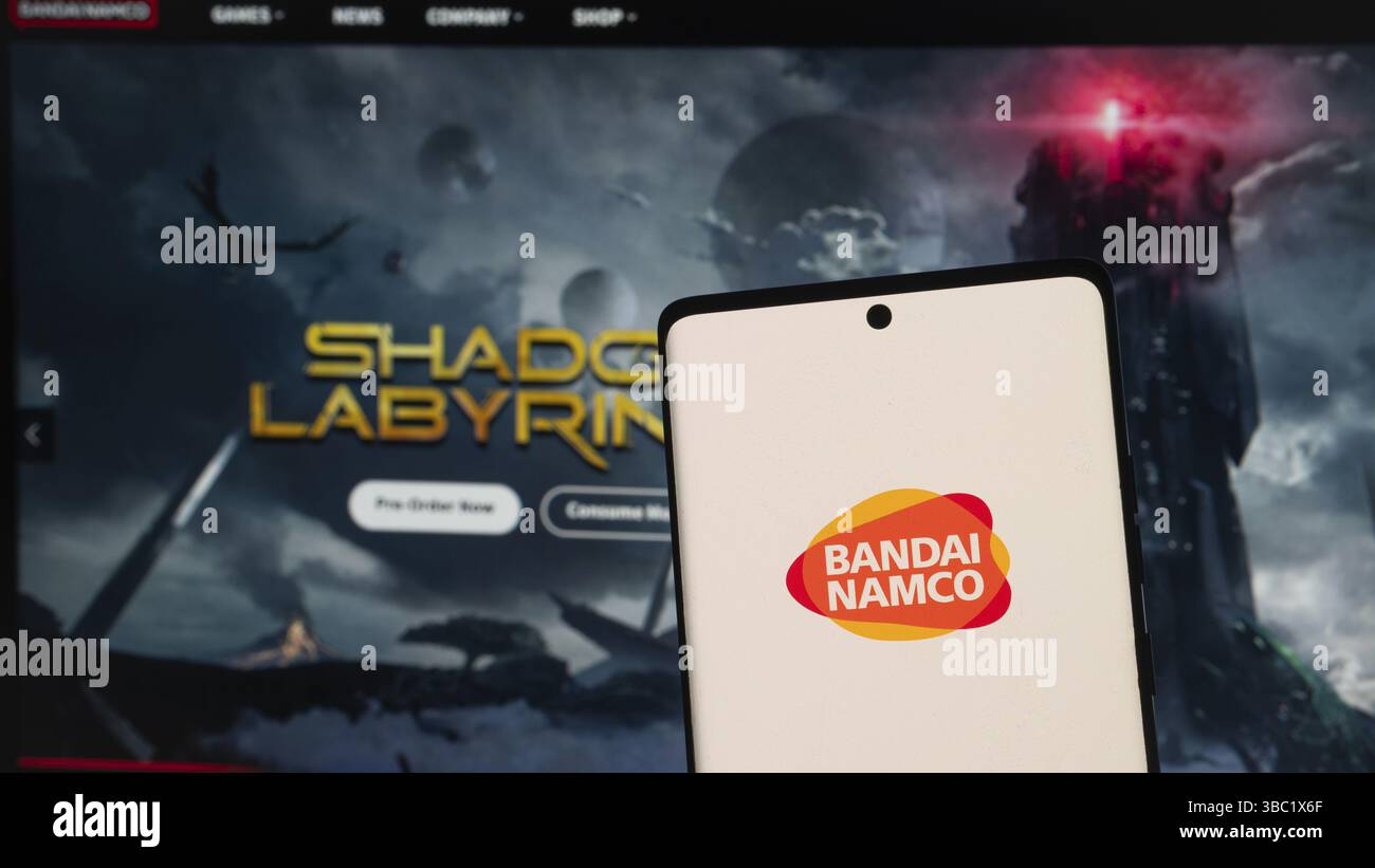 Bandai Namco Entertainment logo is seen on a mobile phone and a ...