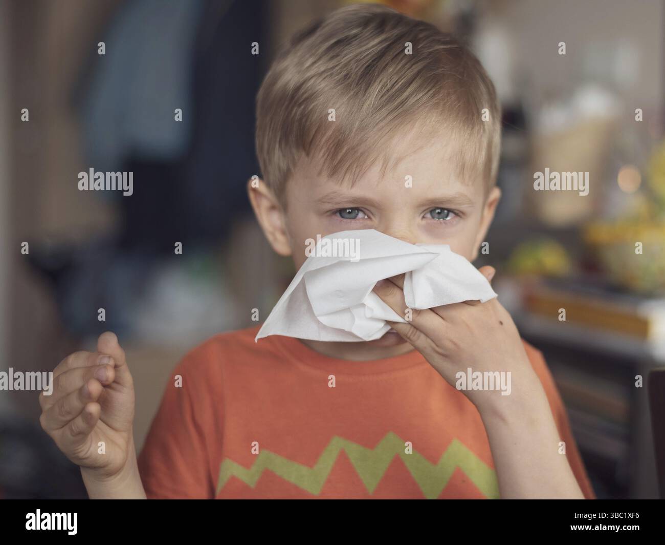 Five years old boy with allergy runny nose and glazed eyes Stock Photo ...