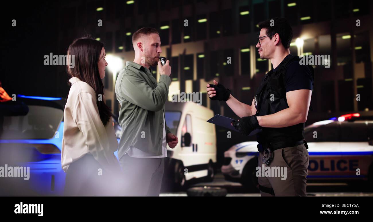 Police Officer Conducts Blood Test At DUI Driving Accident Scene Stock ...