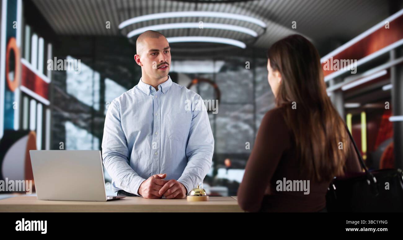 Busy Hotel Concierge Assisting Guests At Reception Desk With Check-in ...