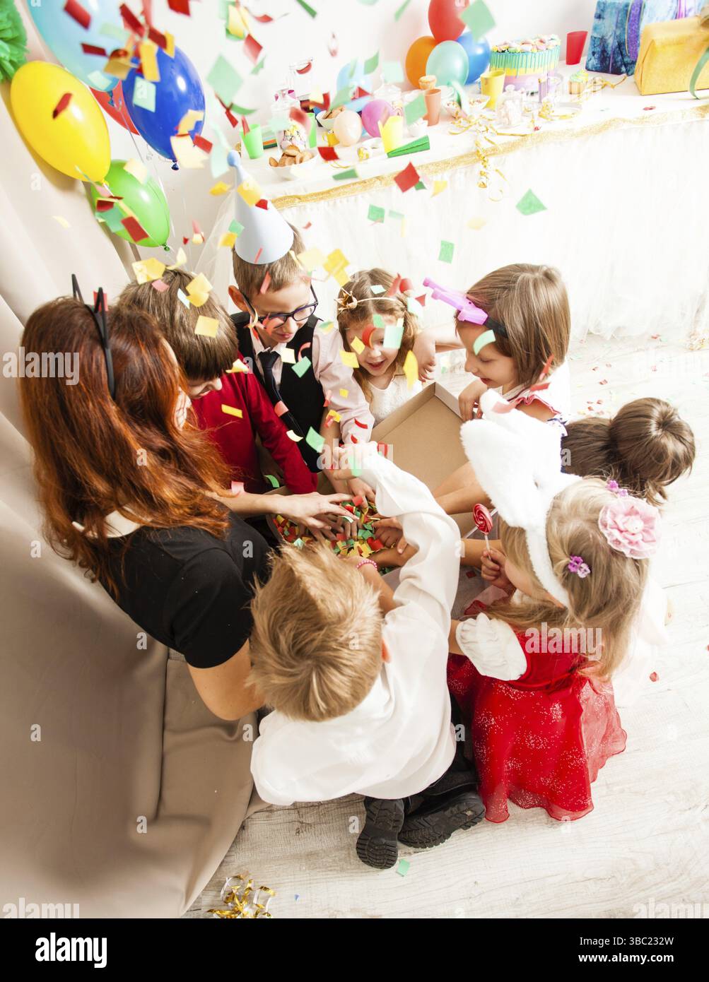 Cute kids playing with animator on the birthday party. Cat woman ...