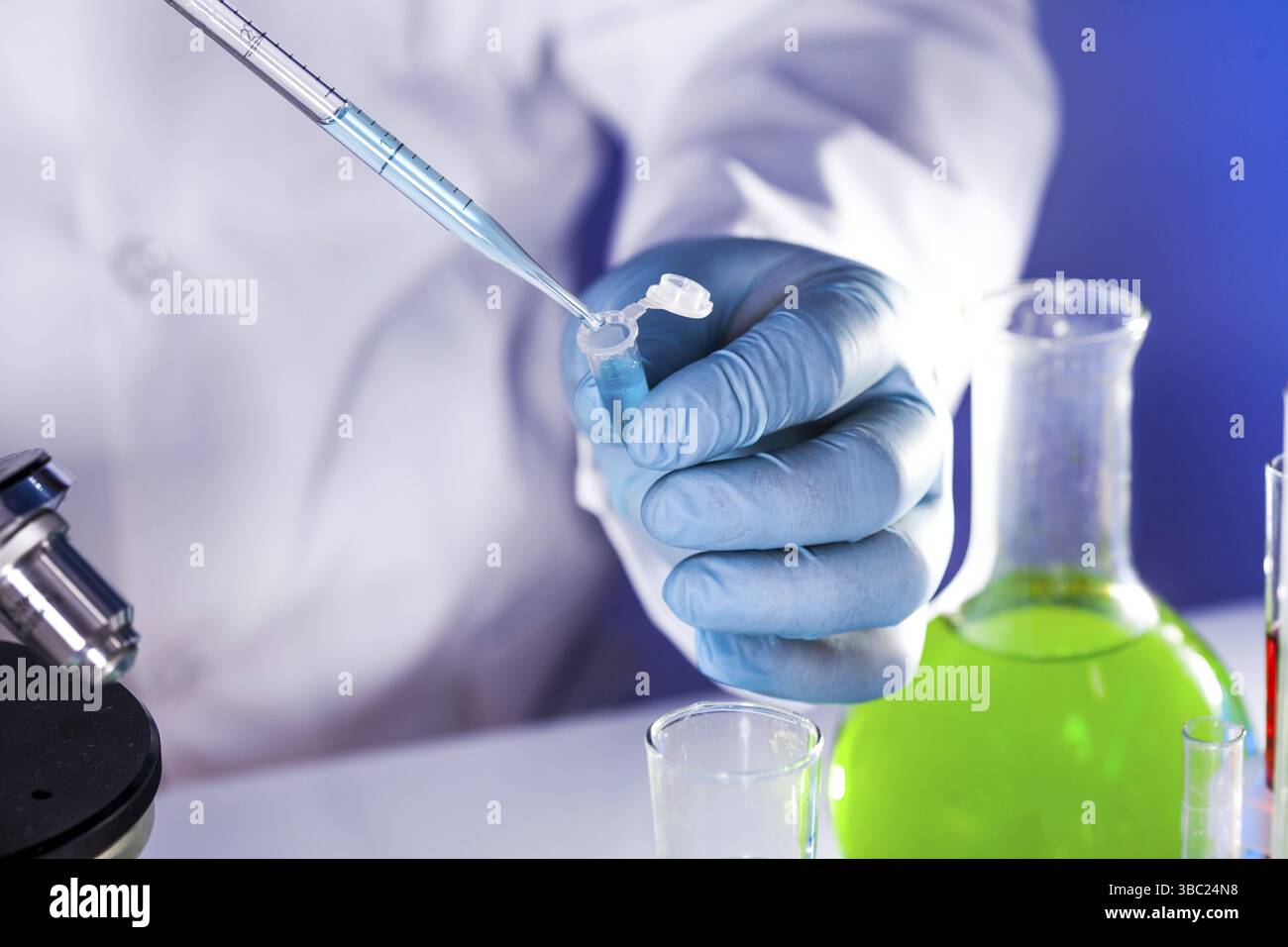 Scientist holds eppendorf tube and pipette - laboratory reseaches Stock ...