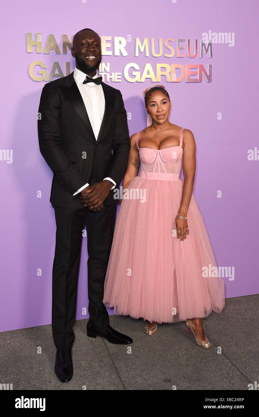 Stormzy, left, and April McDaniel arrive at the 20th annual Hammer ...