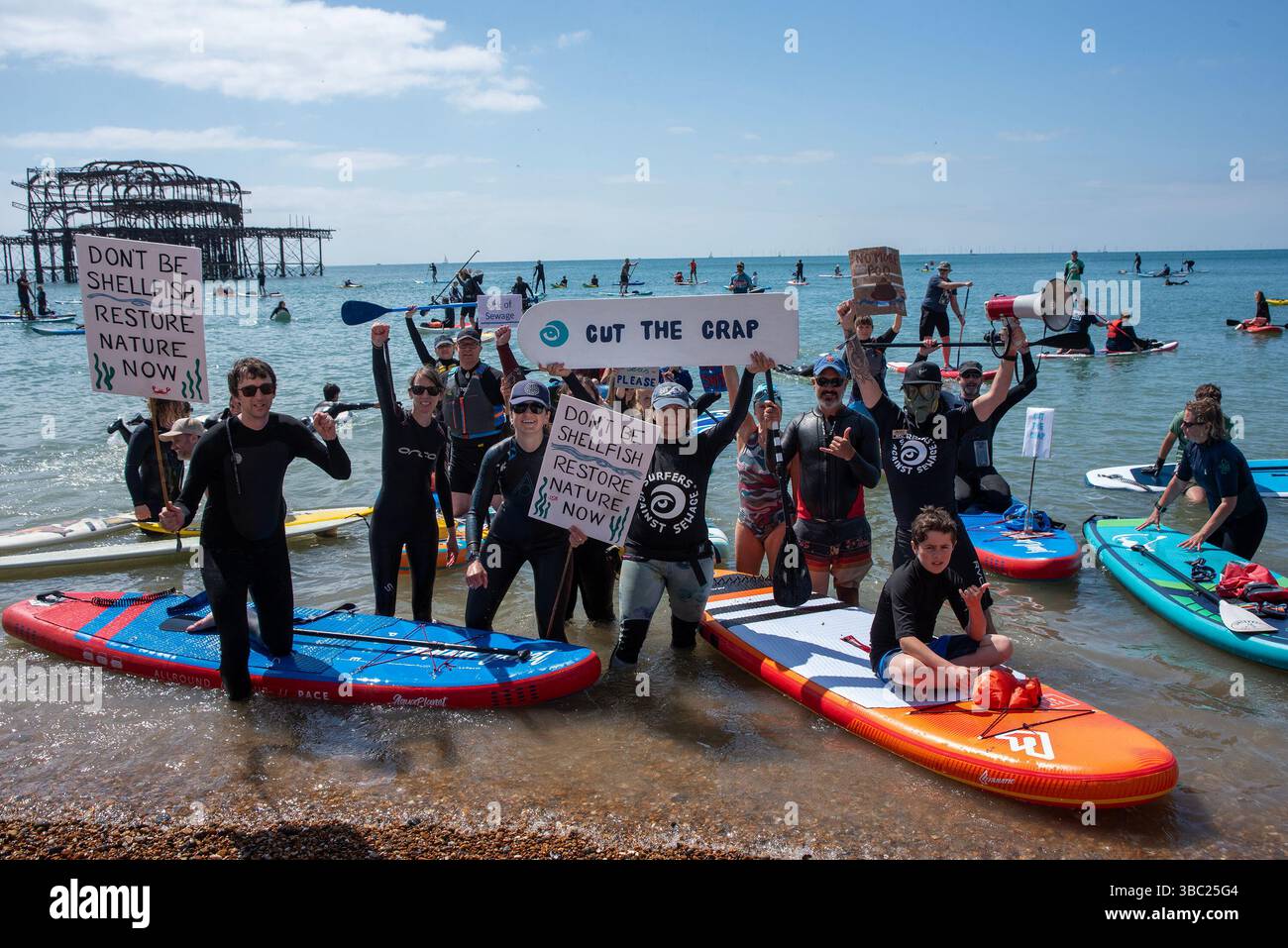 Brighton, UK. 17th May, 2025. Protesters pose for a photo with their ...