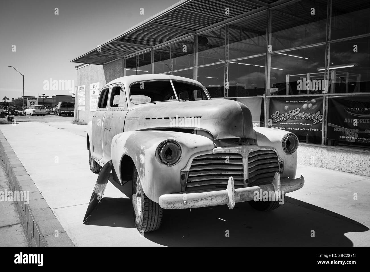 An old 1940’w sedan parked in front of an auto parts store in Yuma ...