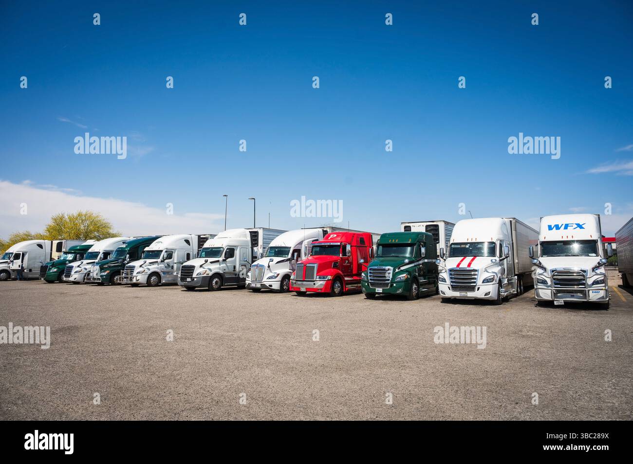 Transport trucks parked at a truck stop along Interstate Five, I-5, in ...