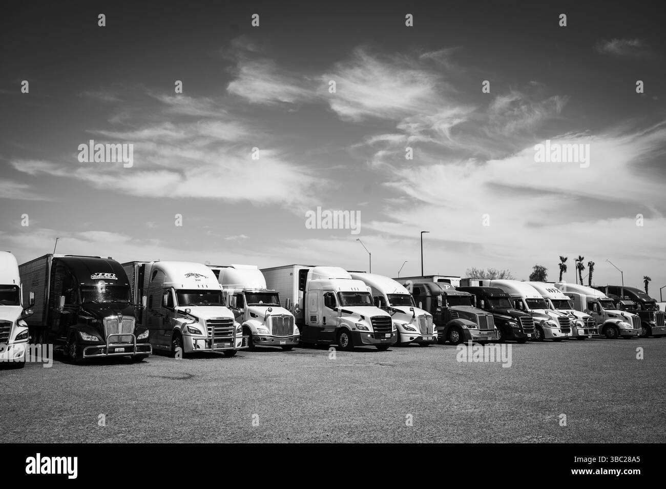 Transport trucks parked at a truck stop along Interstate Five, I-5, in ...
