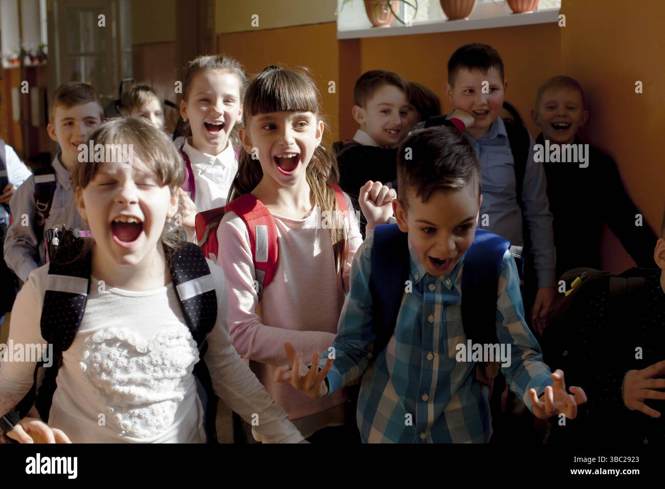 Happy pupils running out of the classroom on summer vacation Stock ...