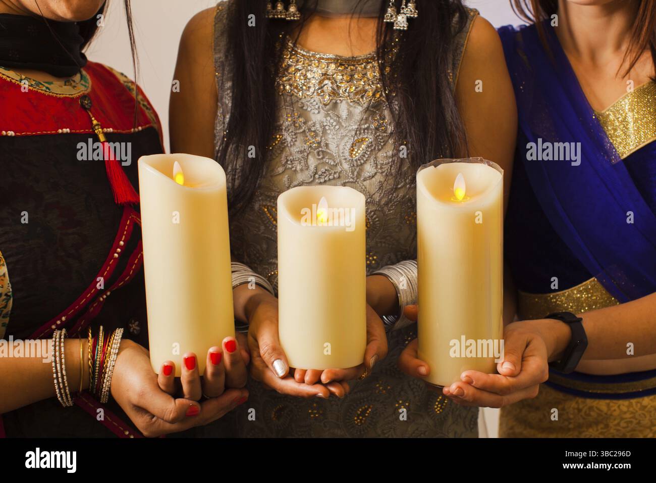 Closeup three large candles hi-res stock photography and images - Alamy