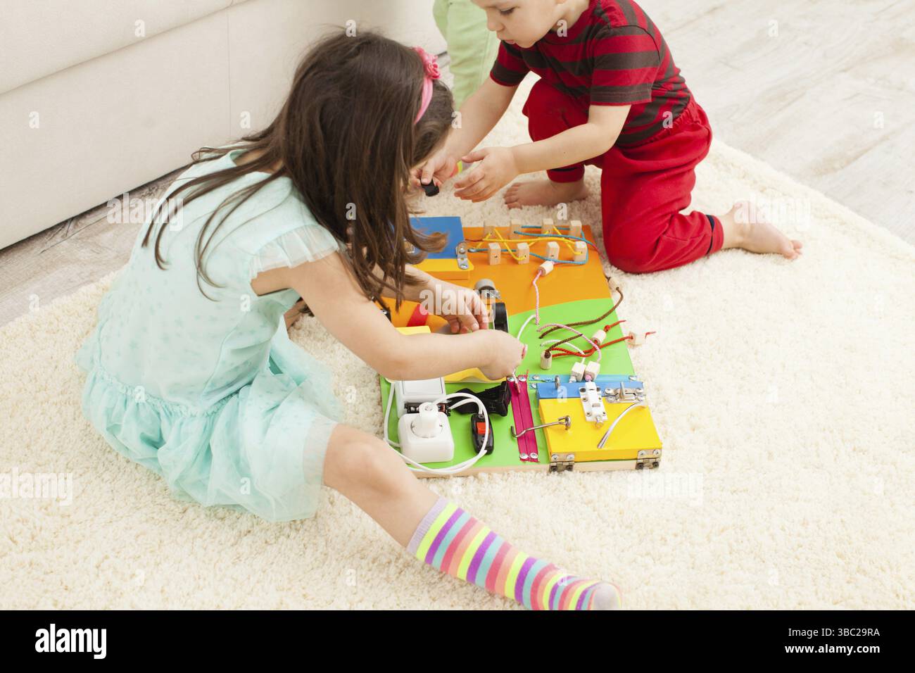 Handmade DIY busy board - sensory children's toy Stock Photo - Alamy