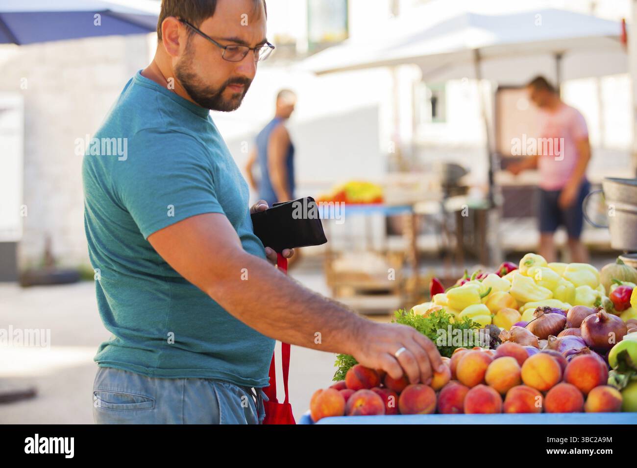 Outdoor market vegetable stand and customer, morning bazar Stock Photo ...