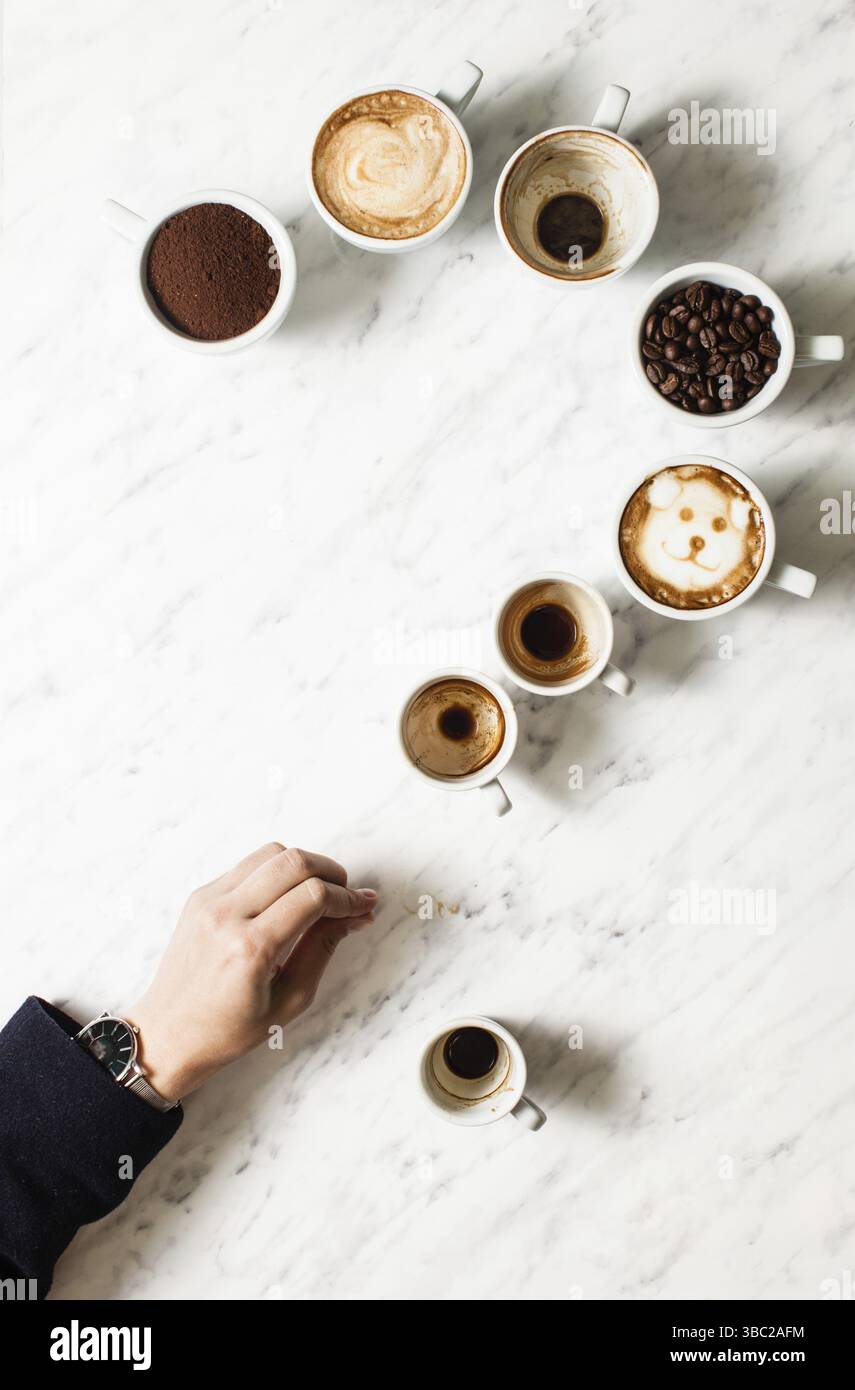 Set of different coffee cups as a question mark, top view, top view ...