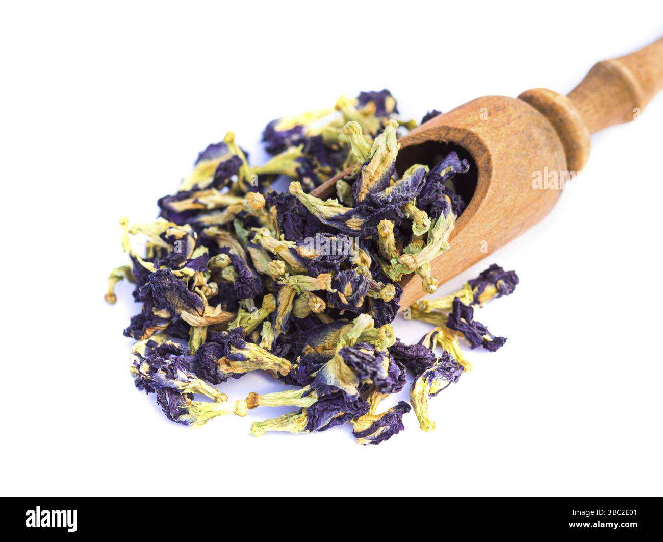 Closeup of wooden scoop filled with dry blue butterfly pea flowers ...